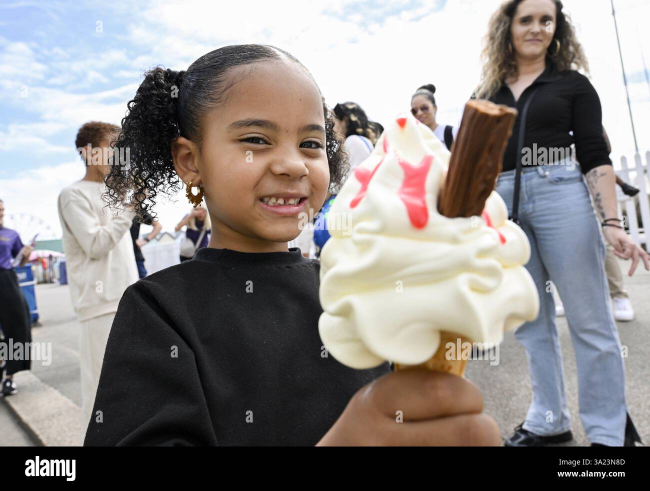 EMBARGOED TO 0001 MONDAY AUGUST 12 EDITORIAL USE ONLY A child holds an ...