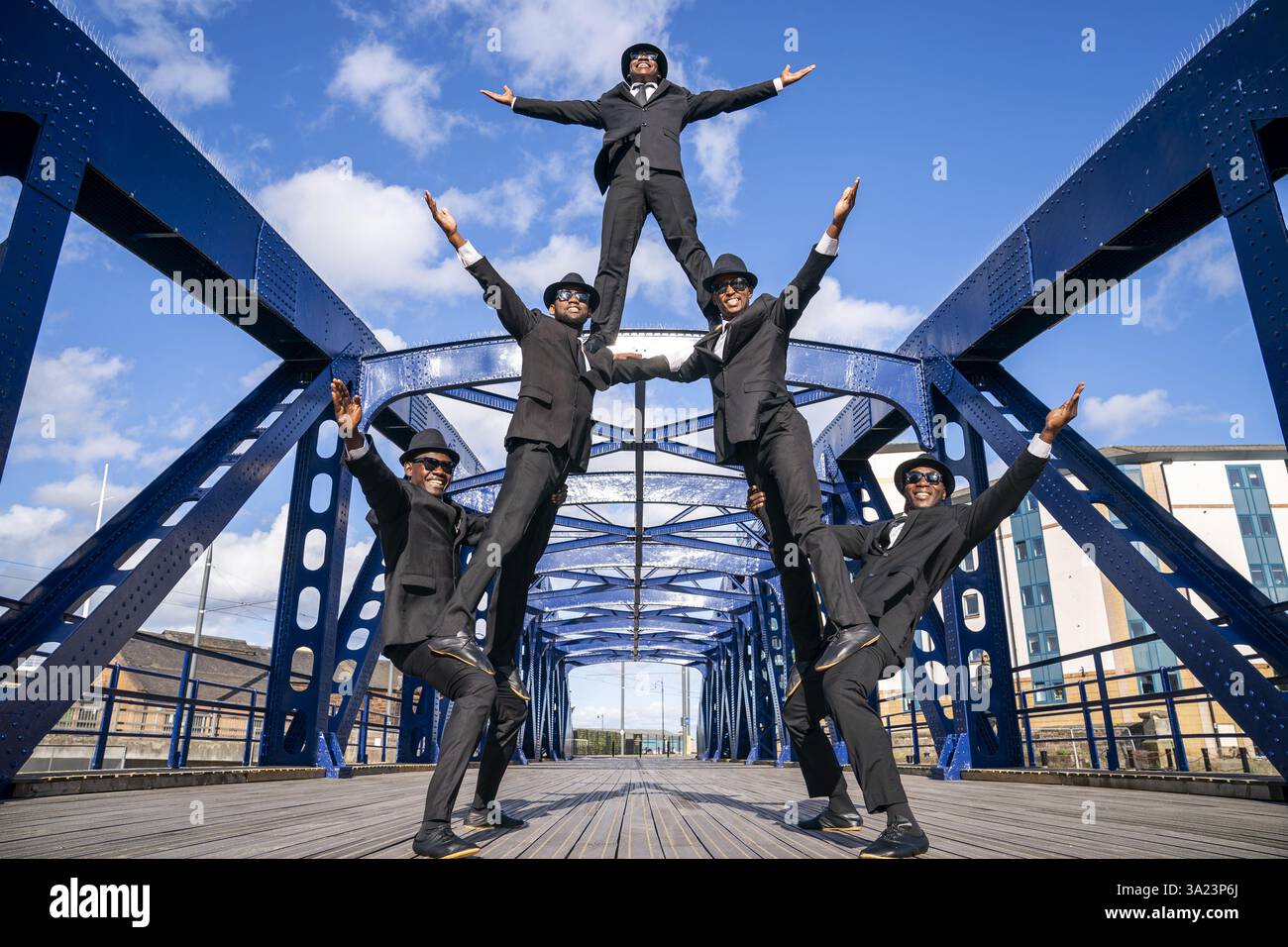 Acrobats from The Black Blues Brothers show off some of their tricks ...