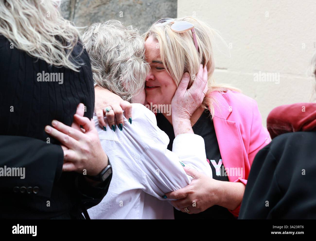 Nell's sister Carmel McCafferty is consoled by Sandra Duffy as they ...