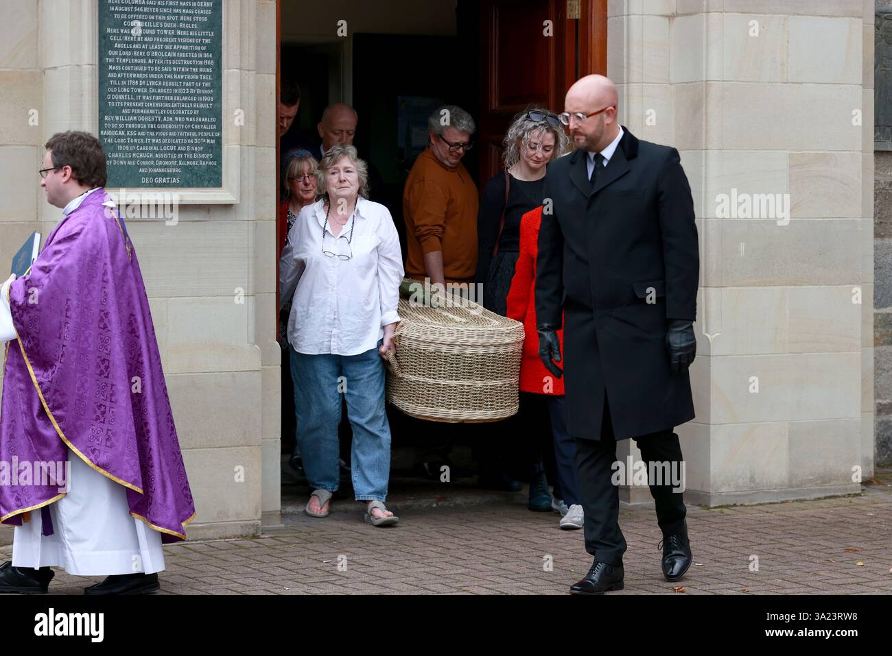 The coffin carrying Nell McCafferty is carried from St. Columba's ...