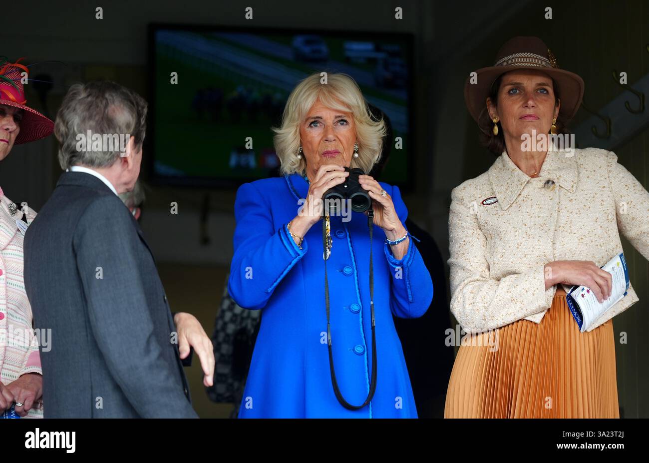 Queen Camilla, with racing manager John Warren and Lady Carolyn Warren ...