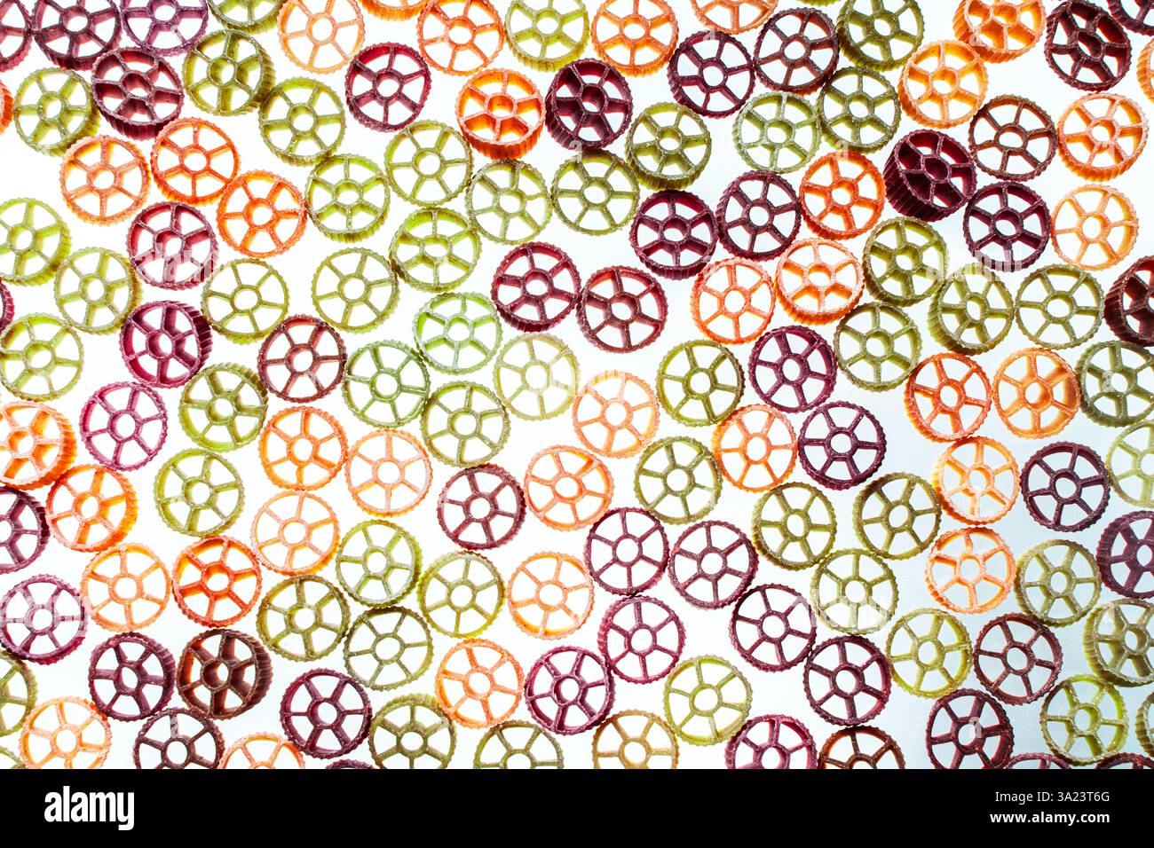 Background with texture dry italian pasta Rotelle. Different flavors ...