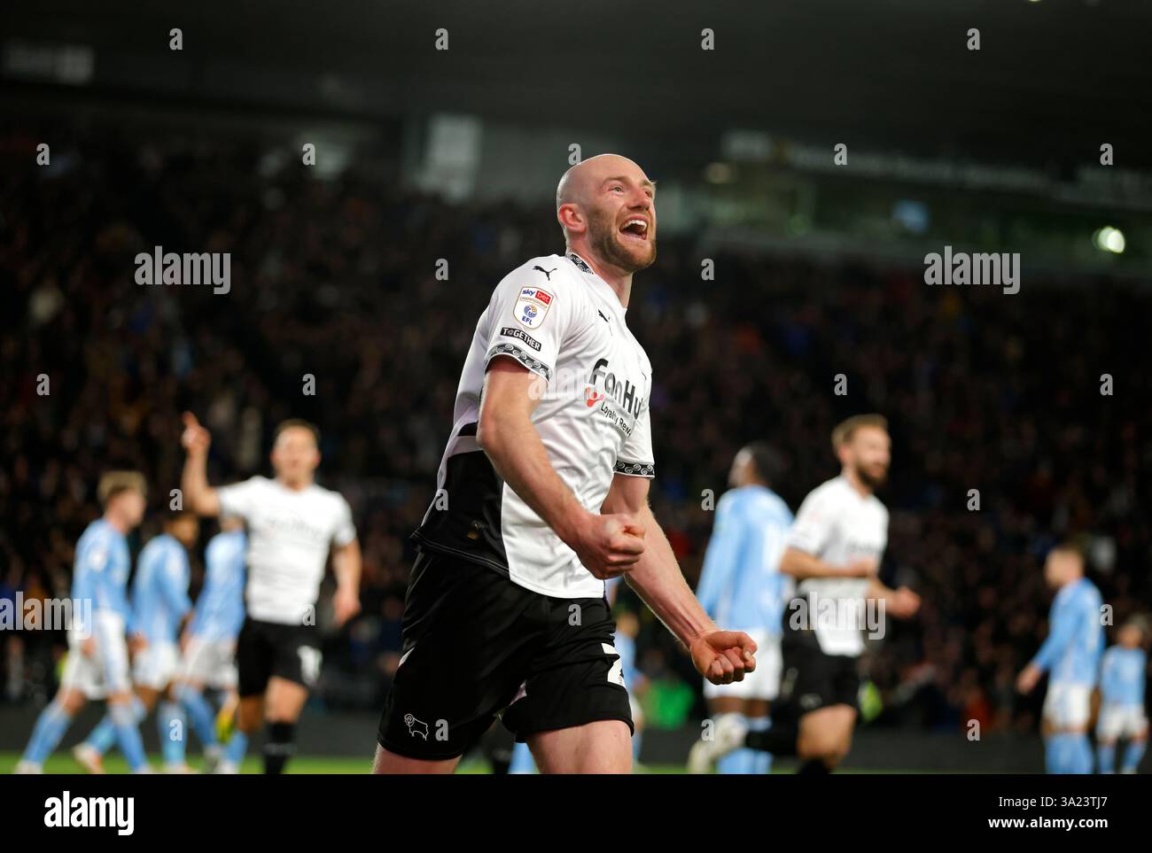 Derby County's Matt Clarke celebrates scoring their side's first goal ...
