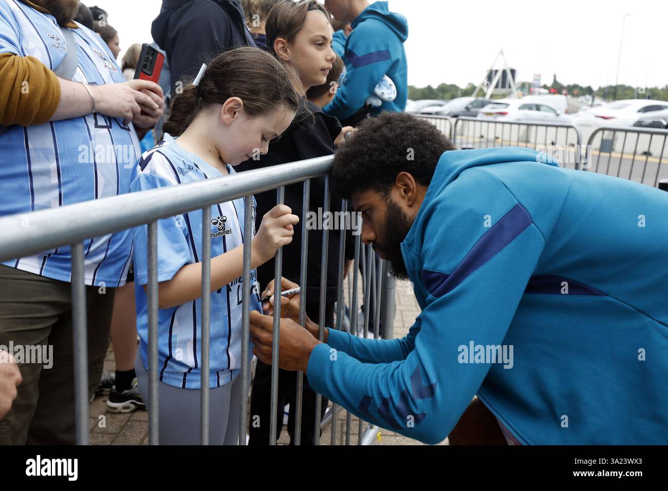 Coventry City's Ellis Simms signs autographs for fans as he arrives for ...