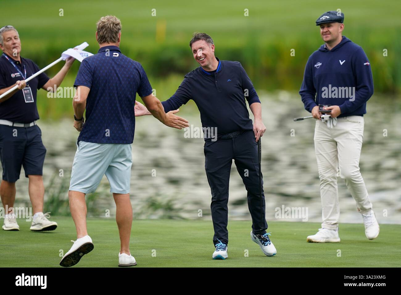 Robbie Fowler (right) and Brian McFadden on the 18th green at the ...