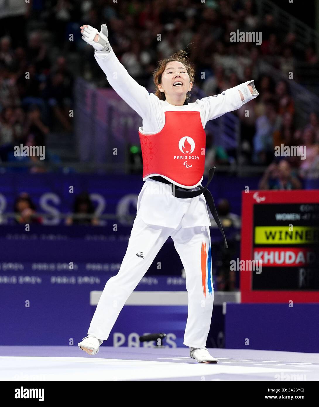 Refugee Paralympic Team's Zakia Khudadadi celebrates victory over ...