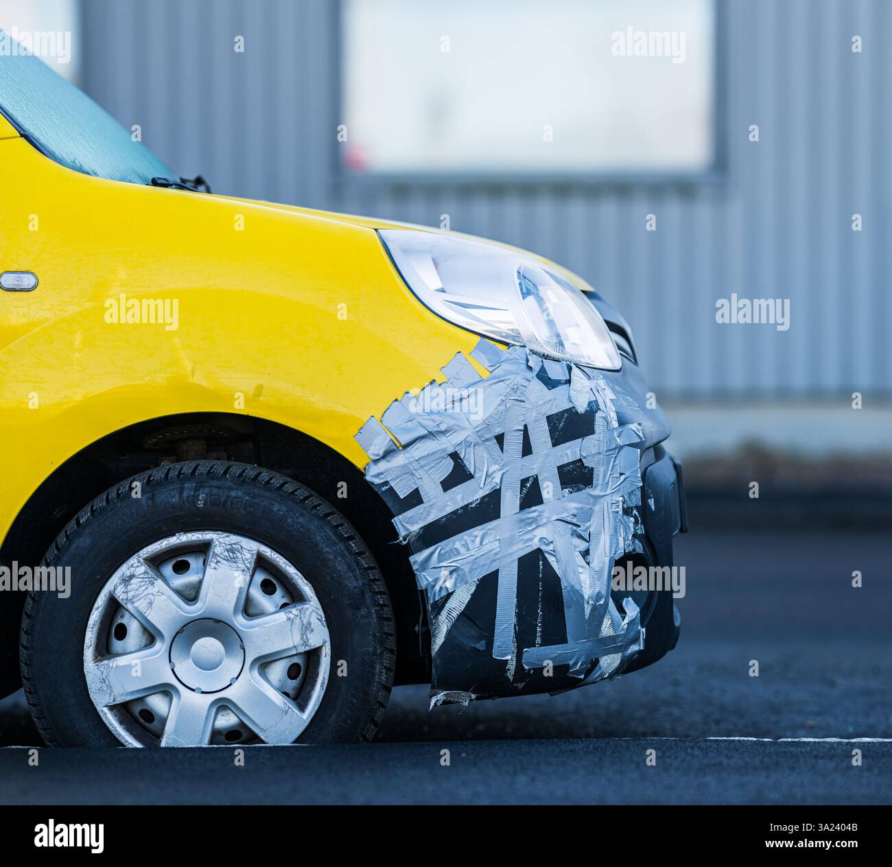 yellow car with duct tape repair on bumper Stock Photo - Alamy