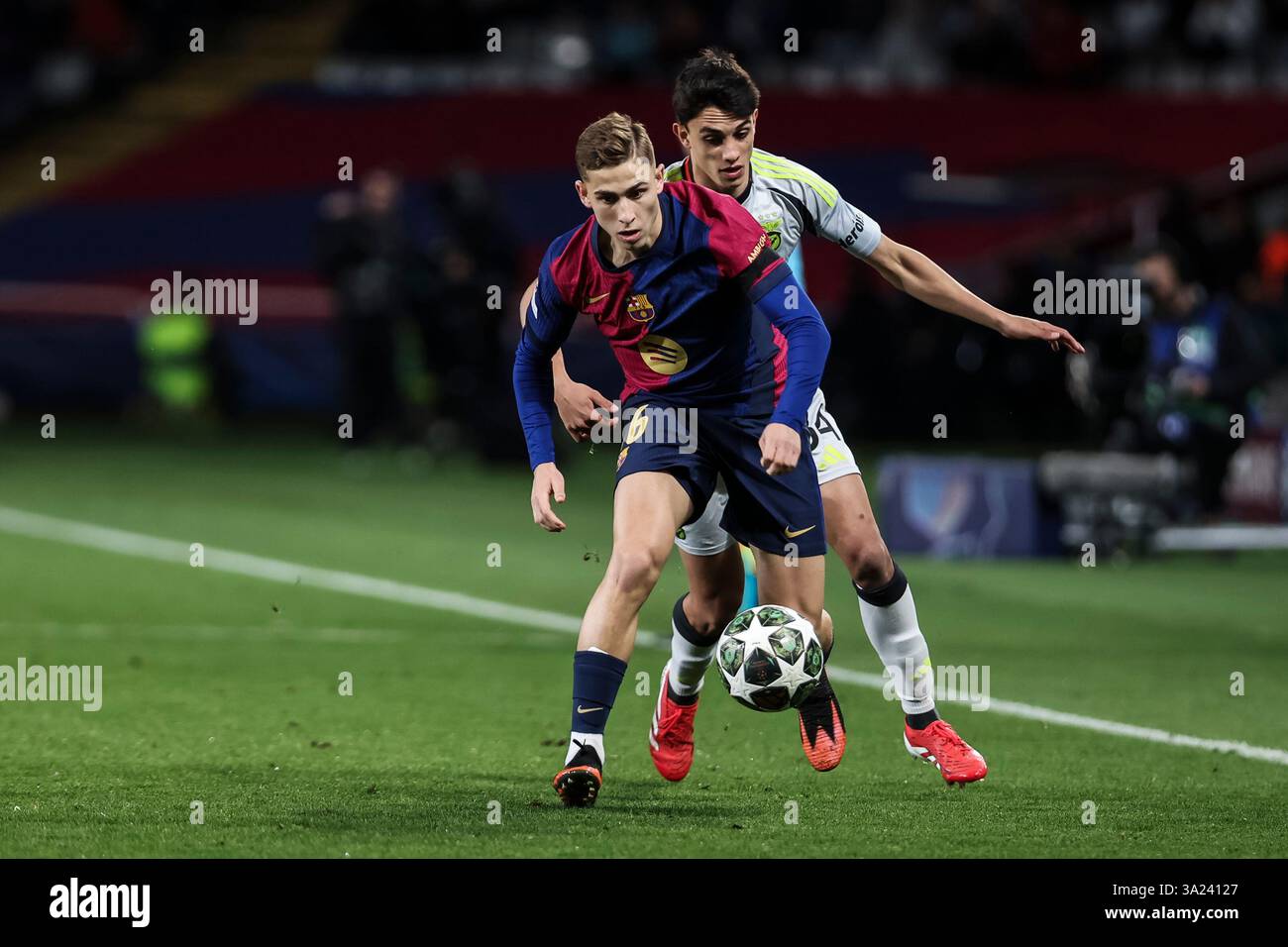 Fermin Lopez of FC Barcelona and Joao Rego of SL Benfica compete for ...