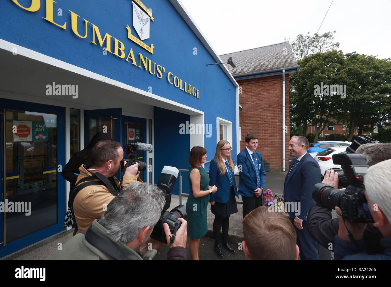 Principal Maria Flynn, Head Girl Abigail Morris and Head Boy Ciaran McCusker greet Education ...