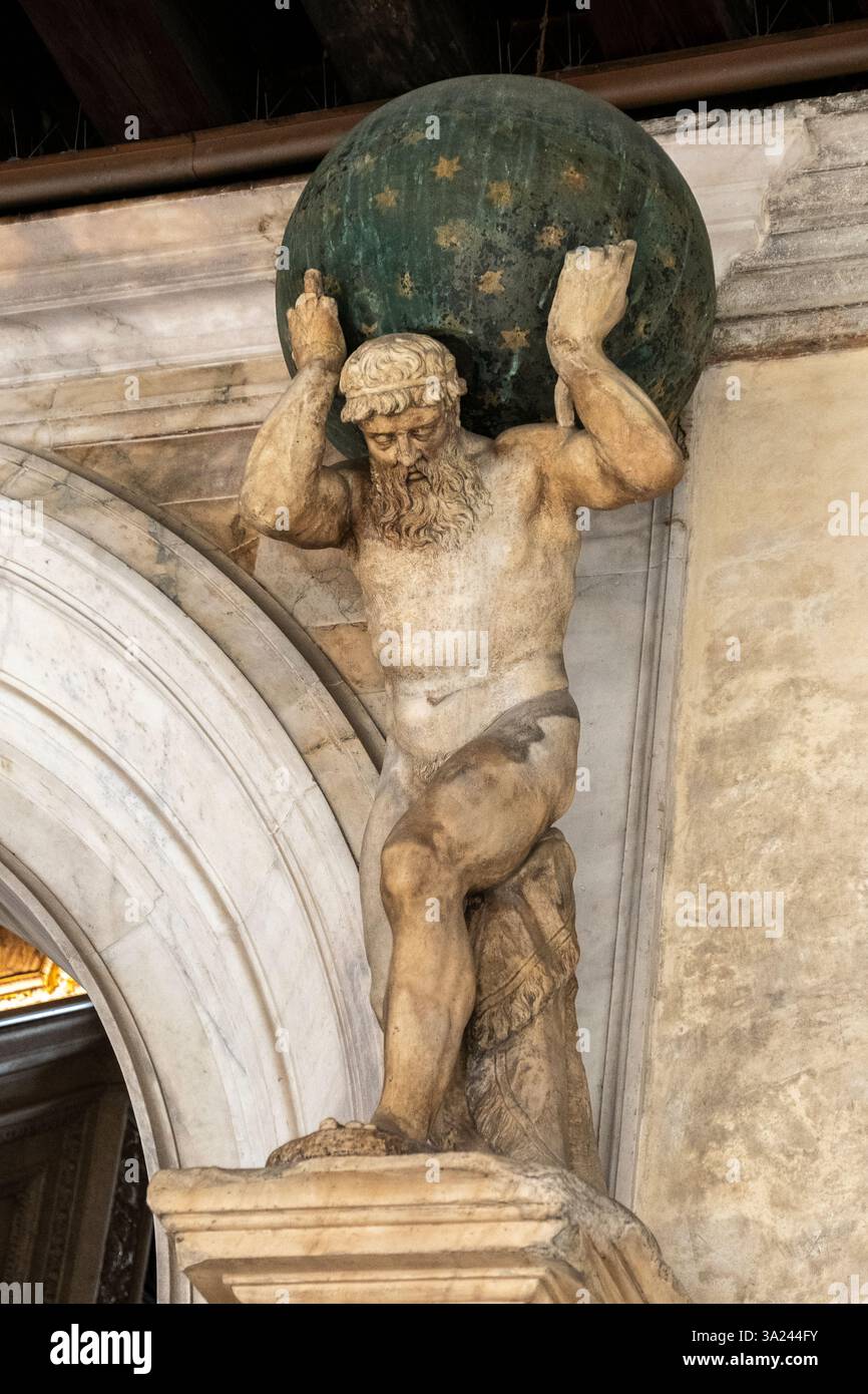 Statue of Atlas carrying the world at Palazzo Ducale, Venice, Italy ...