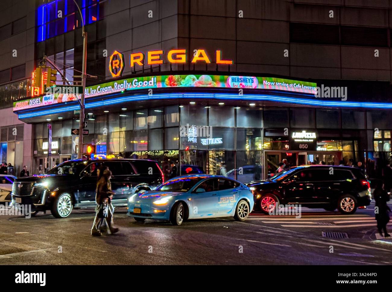 Regal movie theaters and street scene at night, New York City, New York ...