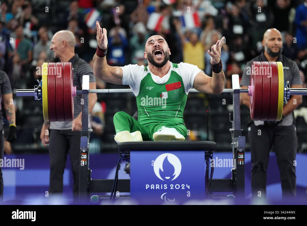 Algeria’s Hocine Bettir celebrates after a successful lift during the ...