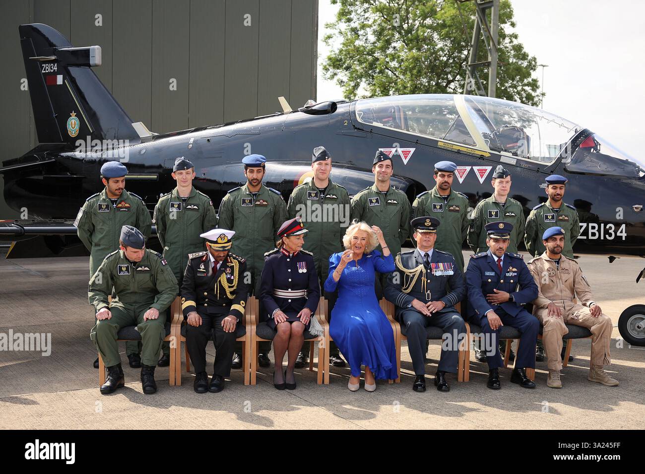 Queen Camilla, Honorary Air Commodore, poses for a group picture with ...