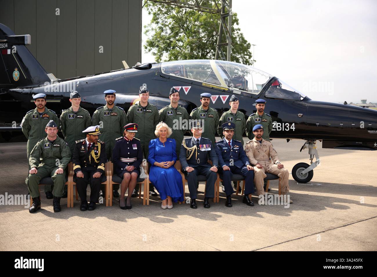 Queen Camilla, Honorary Air Commodore, poses for a group picture with ...