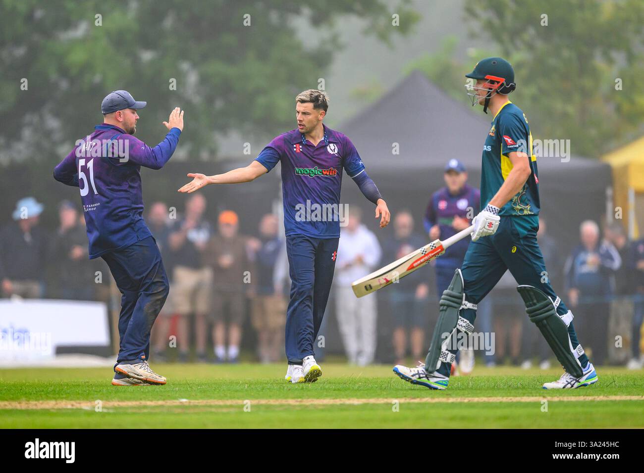 Bradley Currie of Scotland reacts after he claims the wicket of Cameron ...