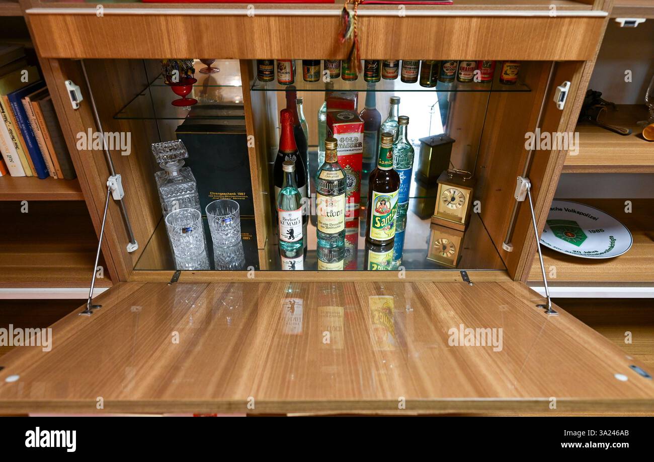 PRODUCTION - 11 March 2025, Berlin: A house bar in a wall unit with GDR ...