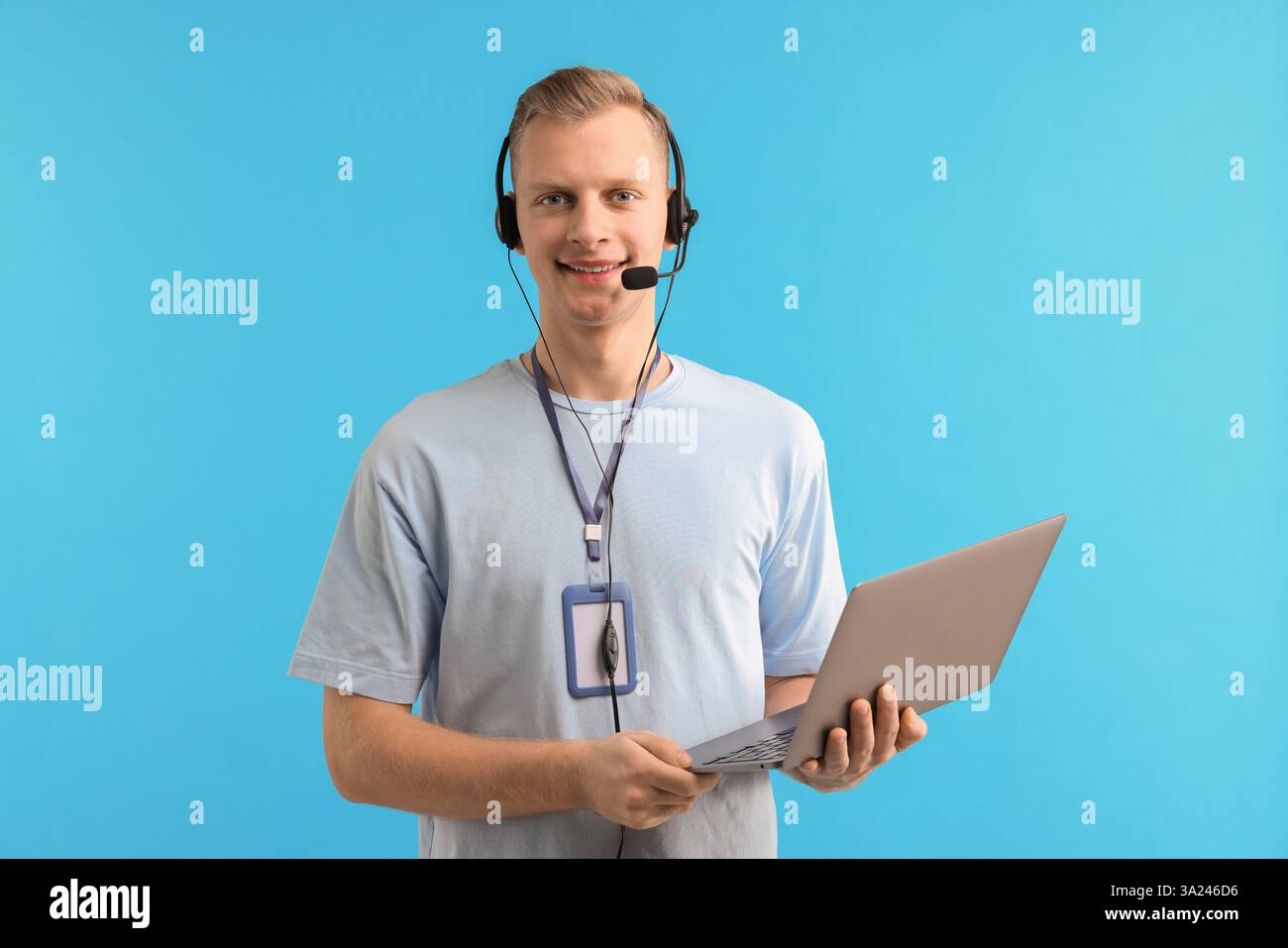 Technical support call center. Smiling operator with laptop on light ...