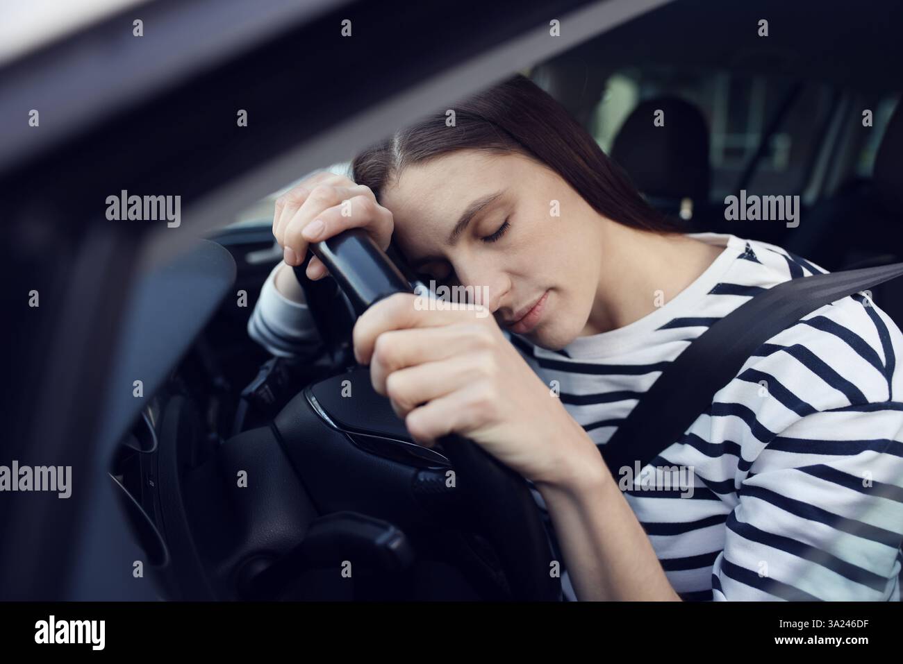 Tired driver sleeping on steering wheel in car, view from outside Stock ...