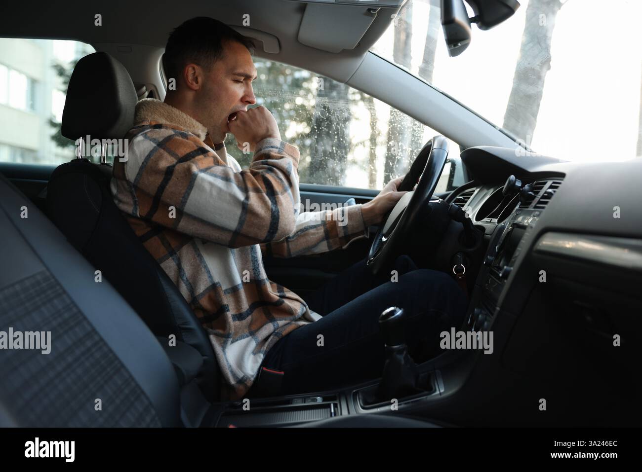 Sleepy driver yawning in his modern car Stock Photo - Alamy