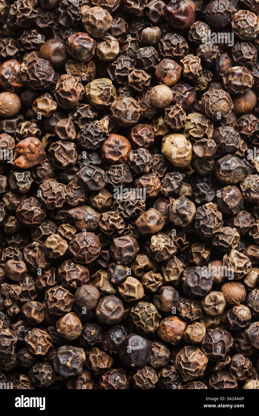 Whole black peppercorns close-up, texture, background Stock Photo - Alamy