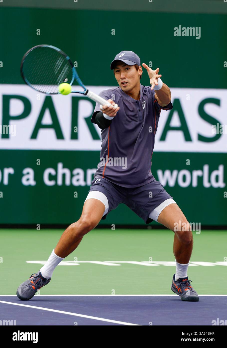 March 11, 2025 Yosuke Watanuki (JPN) returns a shot against Tallon ...