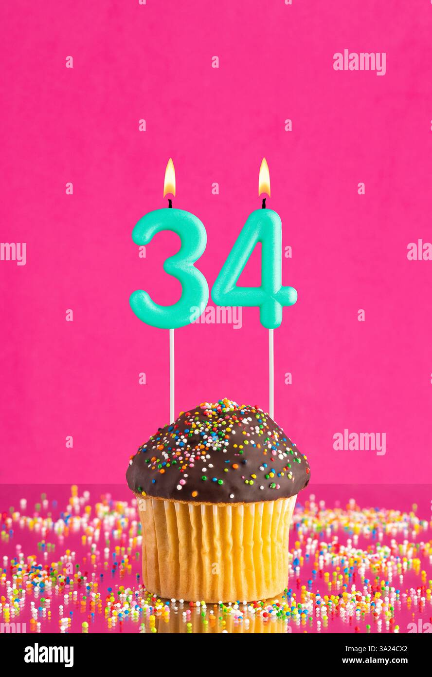 Birthday card with cupcake and number 34 candle - Pink background Stock ...