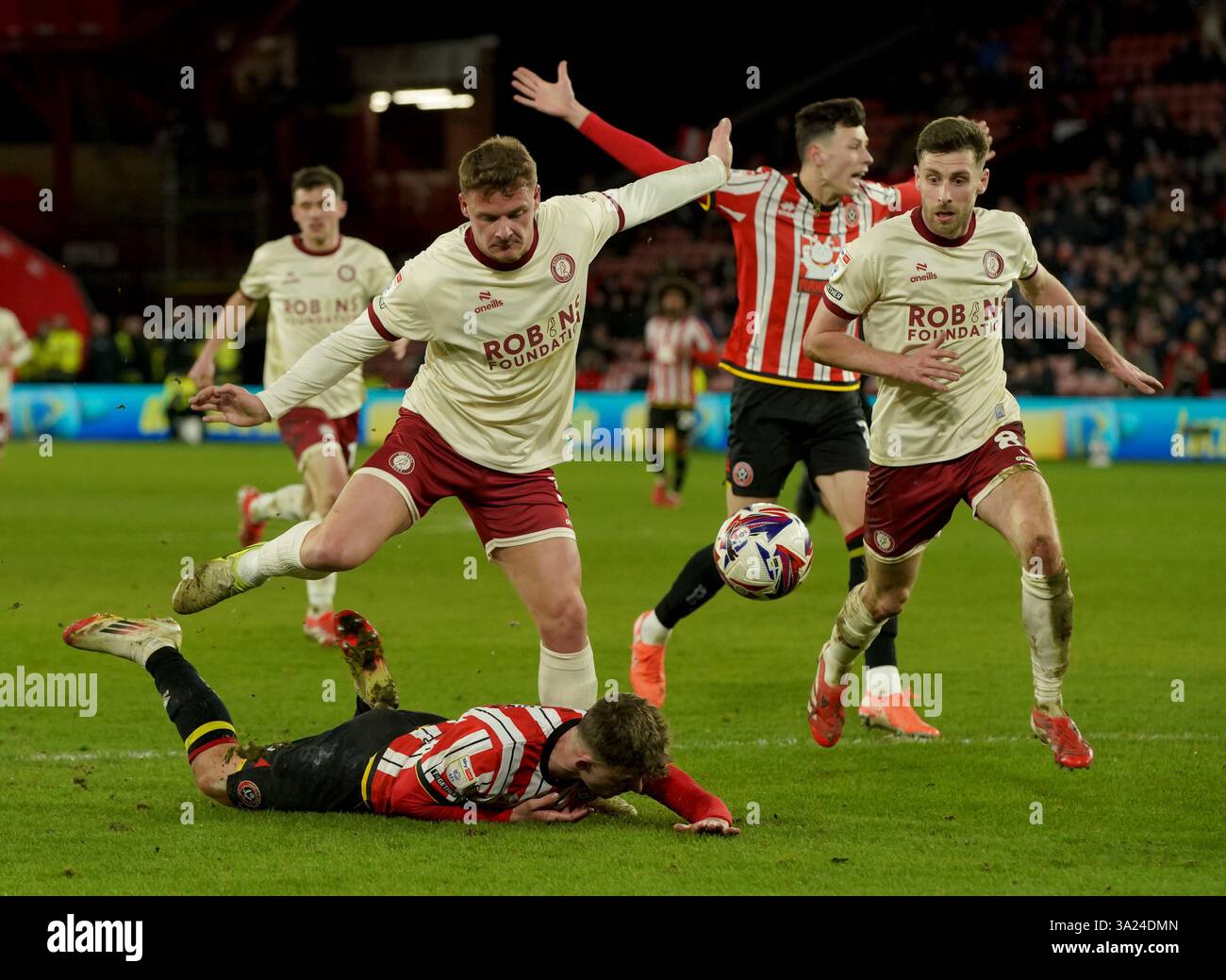 Sheffield United's Harrison Burrows (bottom) goes down in the box under ...