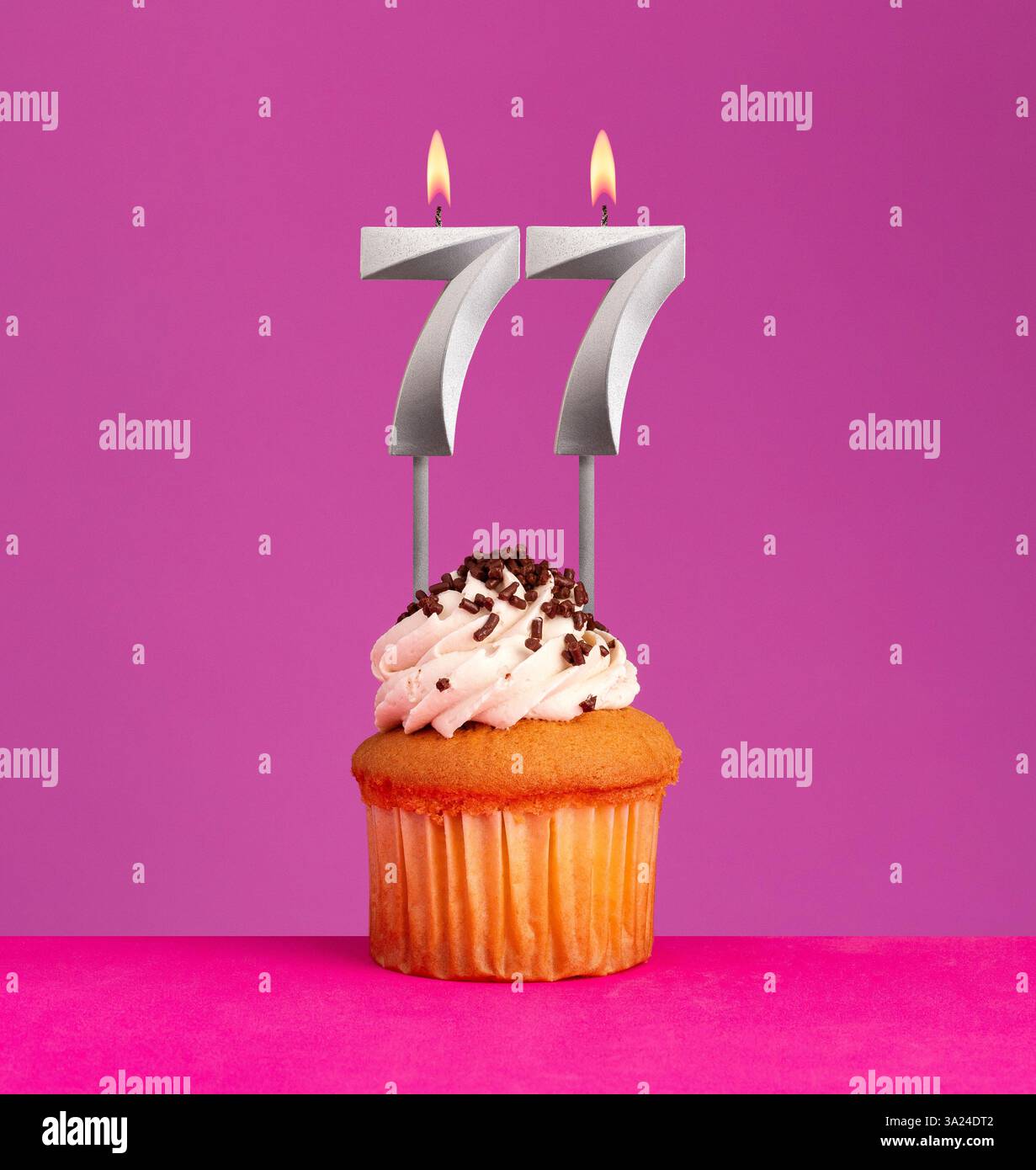Birthday candle number 77 with cupcake on violet background Stock Photo ...