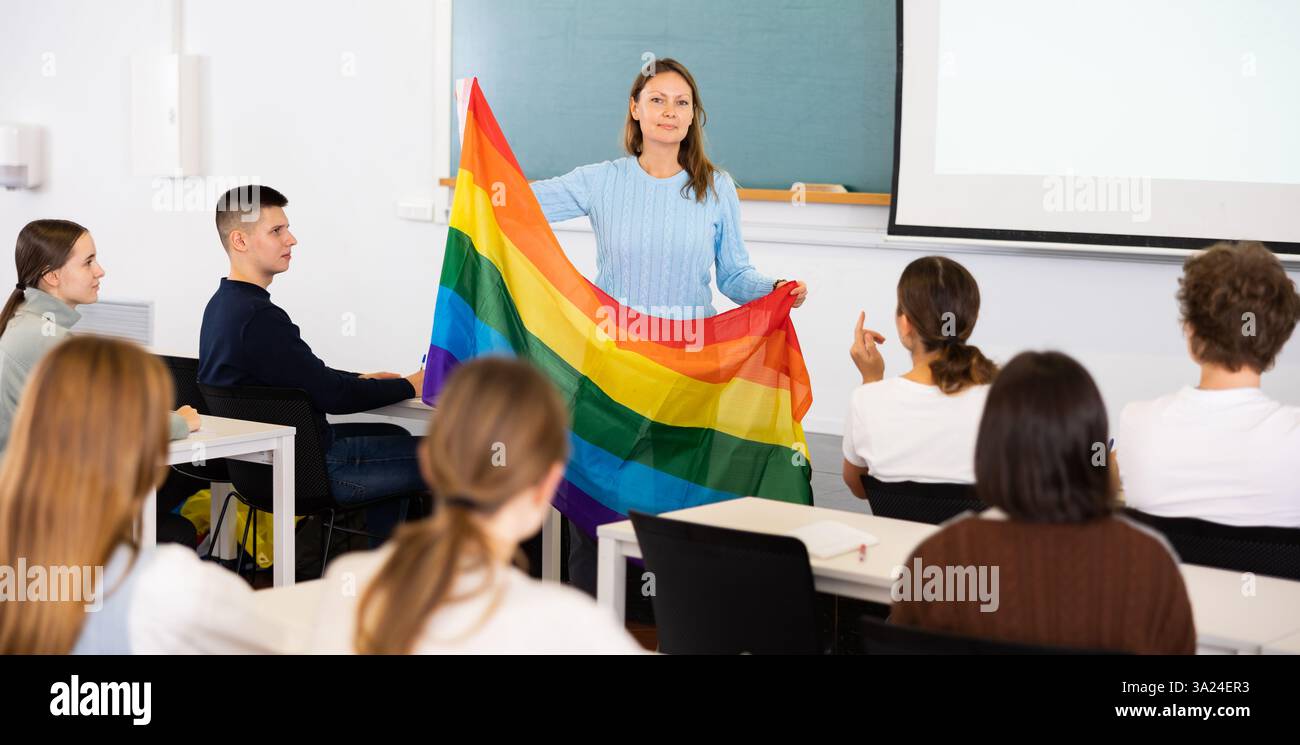 Teacher explaining meaning of LGBT flag to students Stock Photo - Alamy