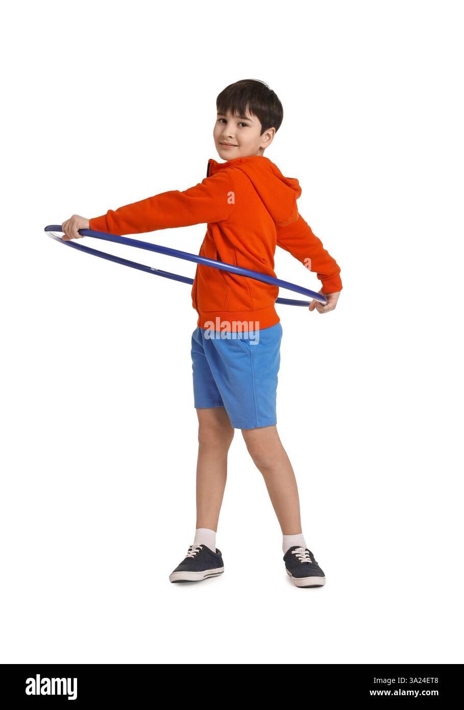 Boy exercising with hula hoop on white background Stock Photo - Alamy