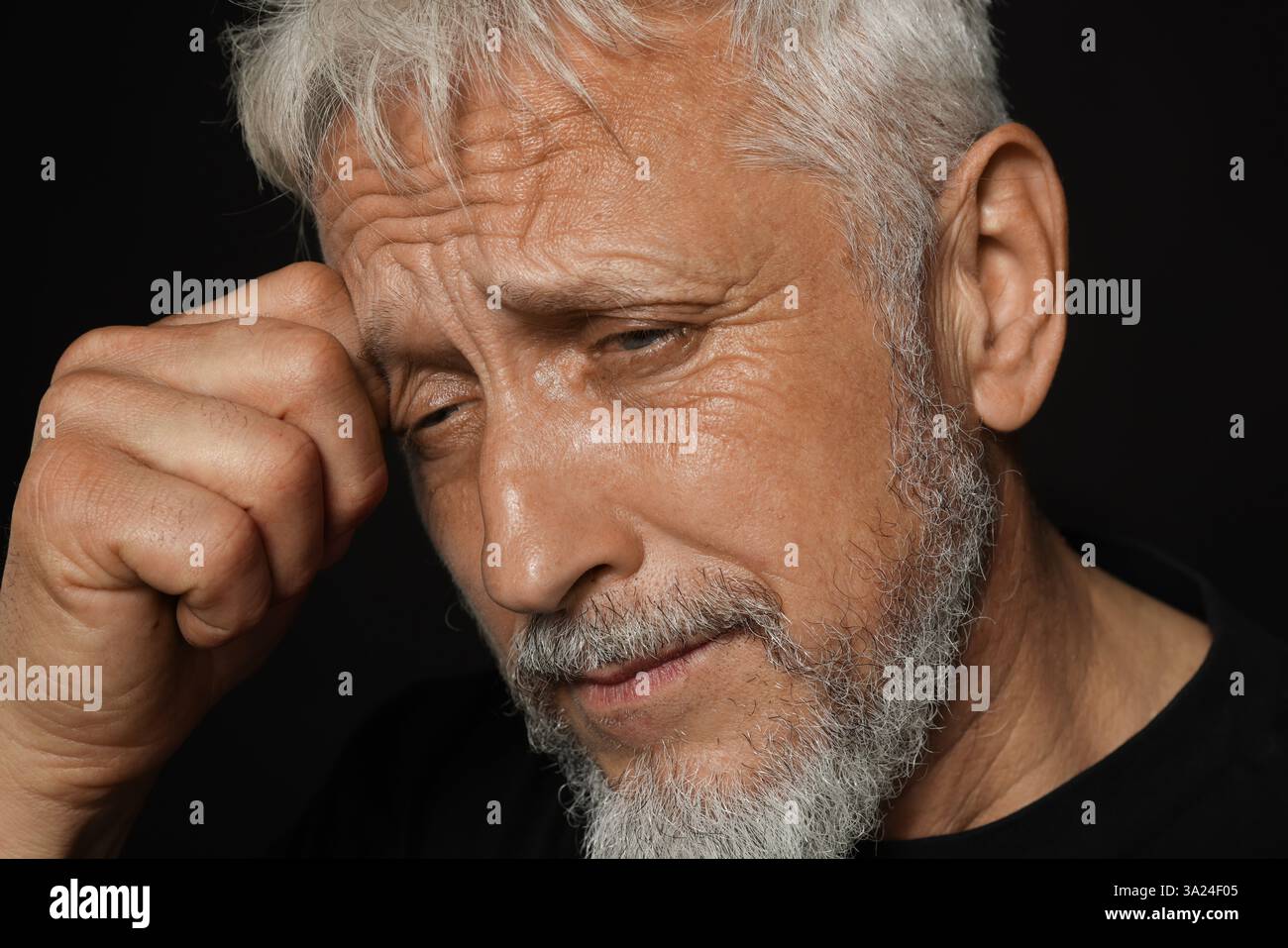 Sad senior man crying on black background, closeup Stock Photo - Alamy