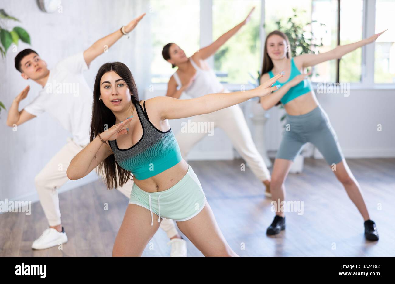 Group of girls and boys dancing and practicing new movements in class ...