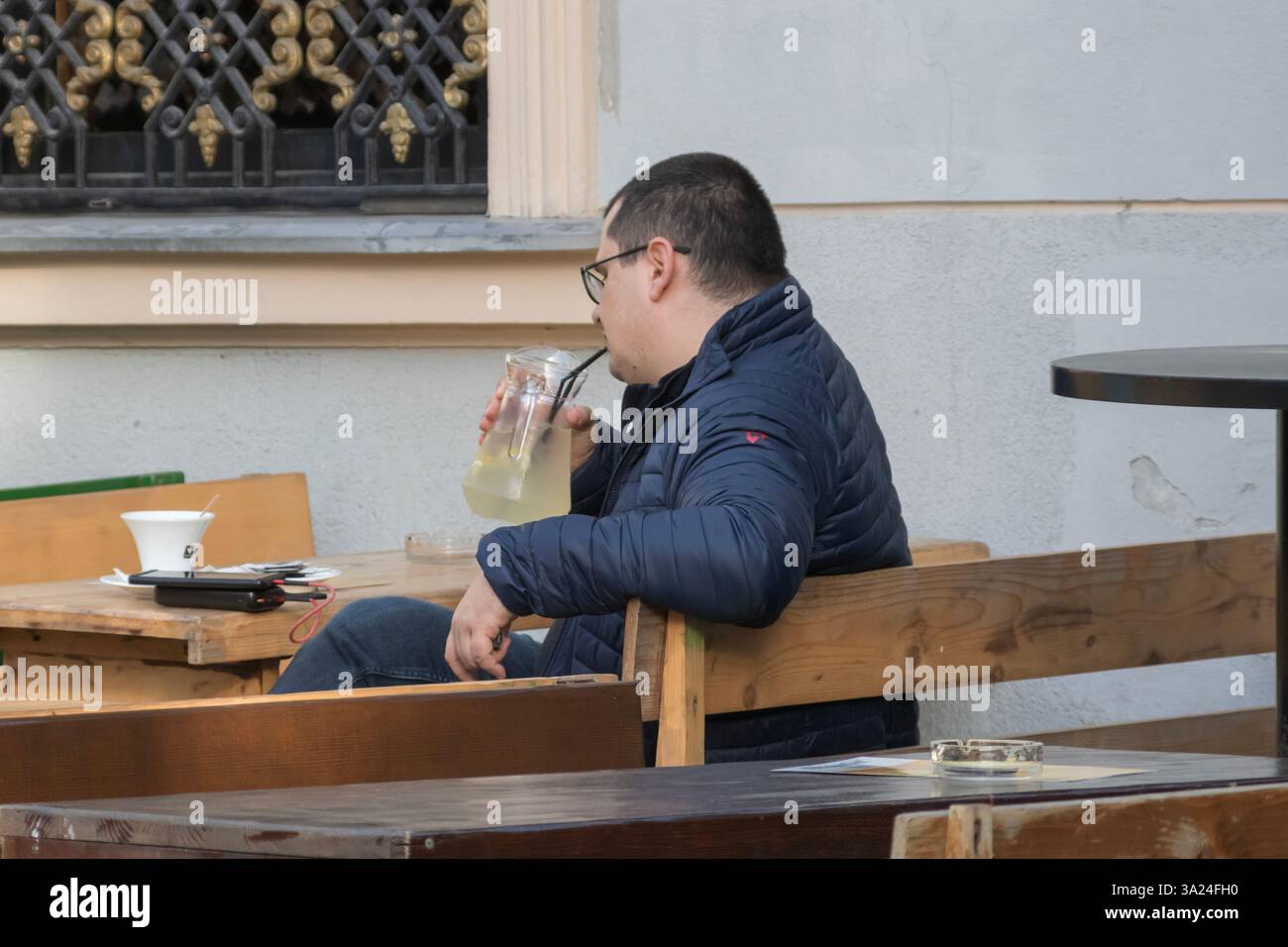 Tourists visiting Bucharest downtown and enjoying local restaurants at ...