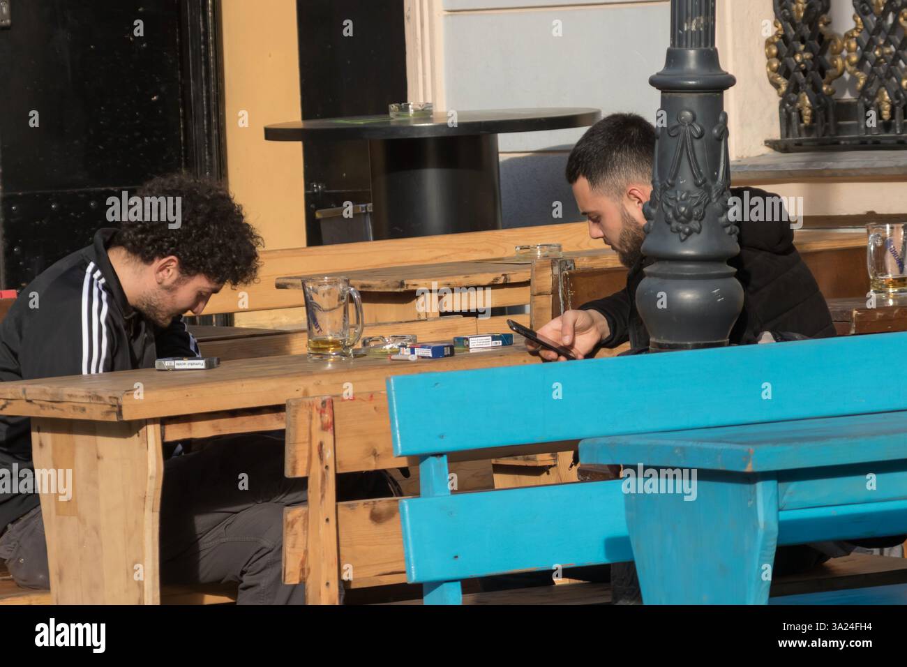 Tourists visiting Bucharest downtown and enjoying local restaurants at ...