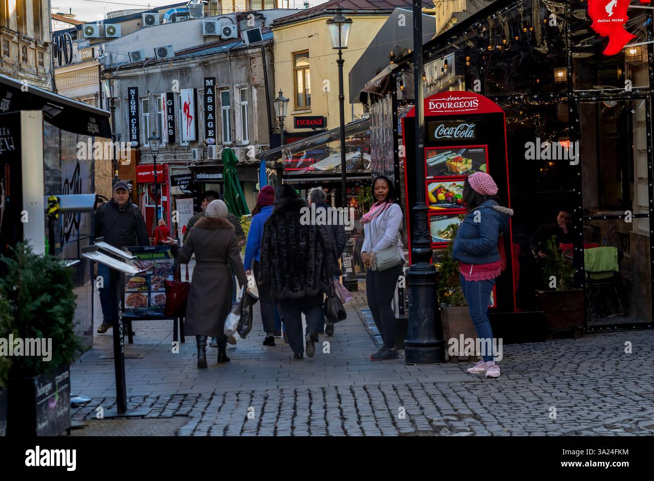 Tourists visiting Bucharest downtown and enjoying local restaurants at ...