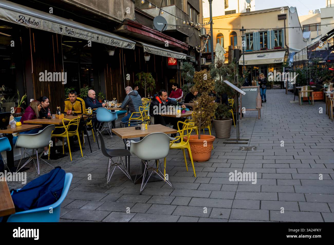Tourists visiting Bucharest downtown and enjoying local restaurants at ...