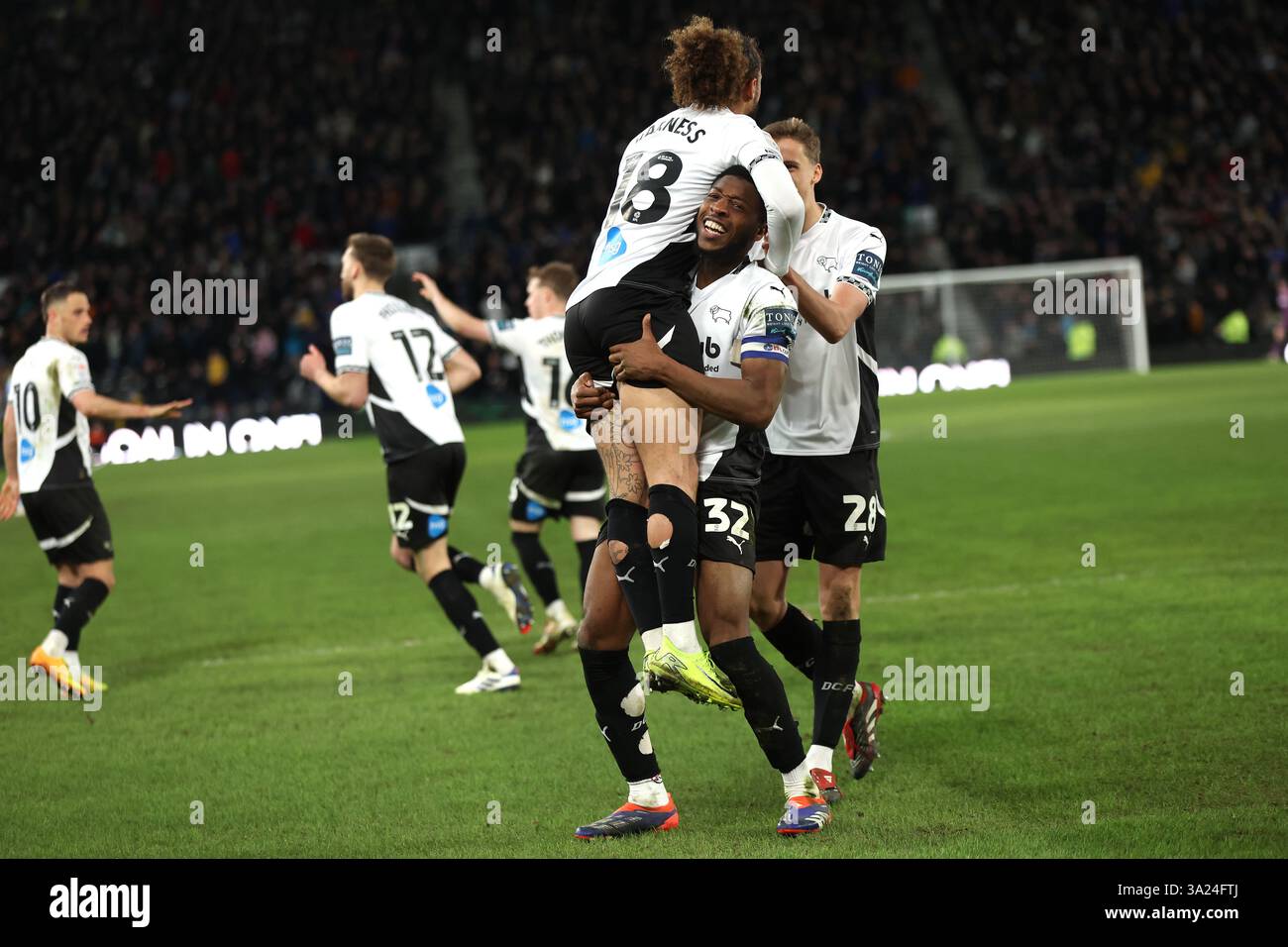 Derby County's Marcus Harness (left) celebrates scoring their side's ...