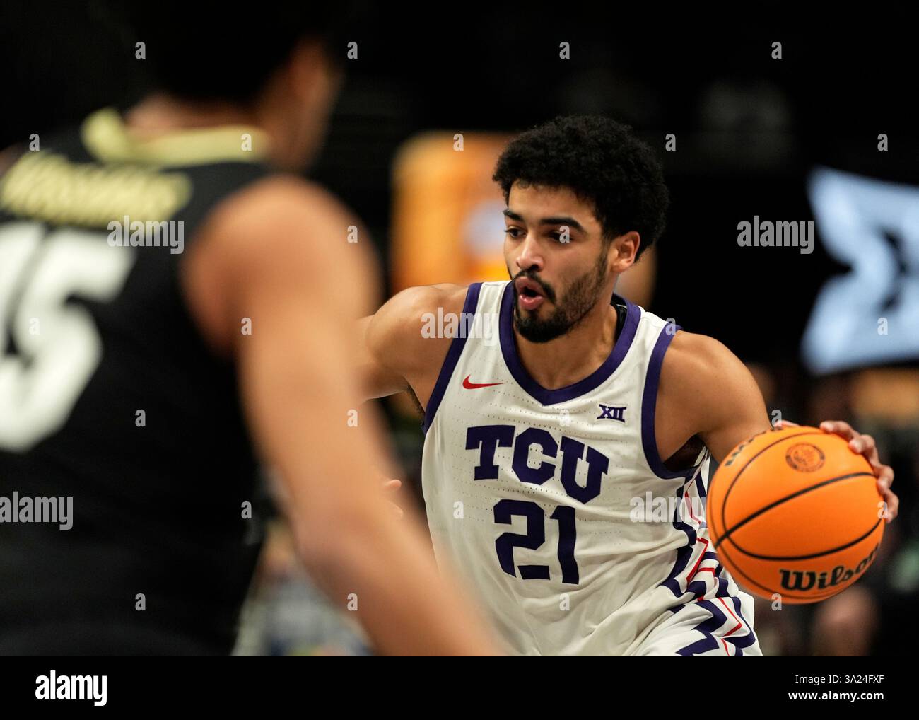 MAR 11 2025: TCU Horned Frogs guard Noah Reynolds (21) drives the ball against Colorado in the ...