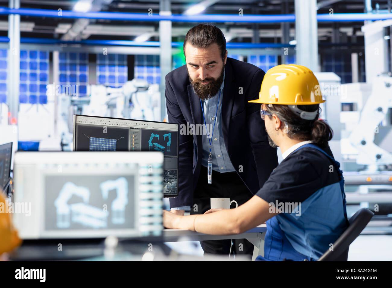 Solar panels plant manager giving feedback to employee on optimizing efficiency after analyzing ...