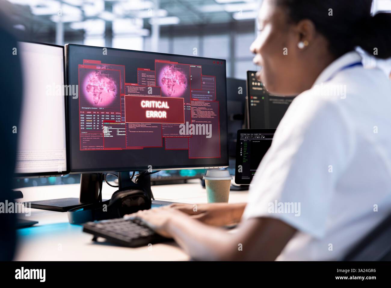African American Computer Scientist In Server Hub Working To Protect Equipment From Hacker