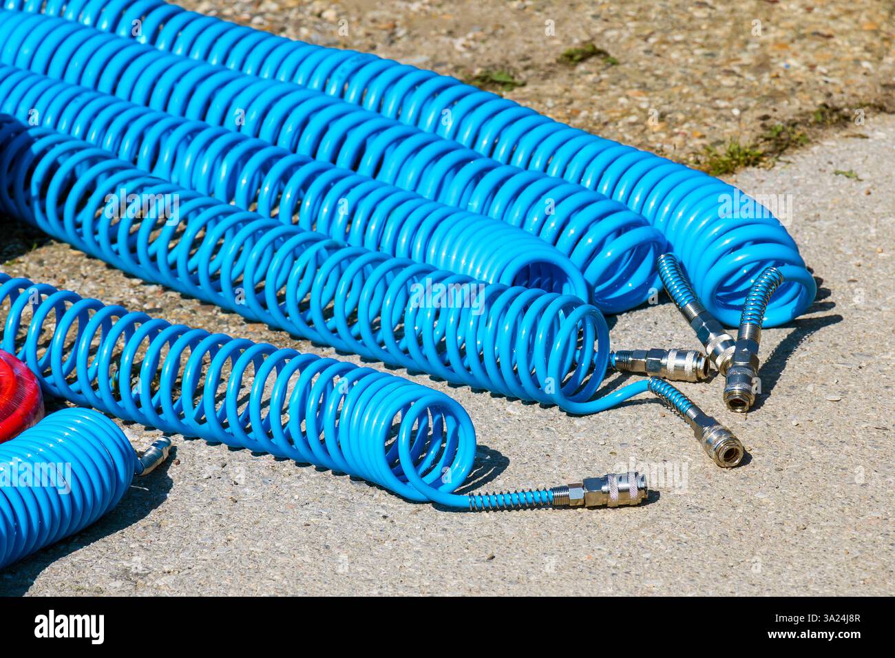 High pressure air hoses with connection valves on ground Stock Photo ...