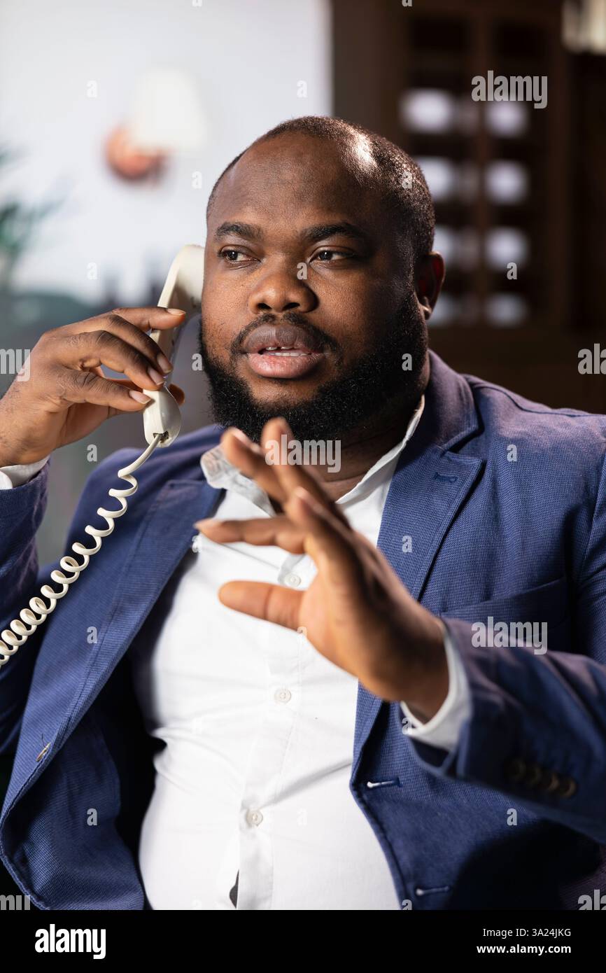 African american intelligence agent on a secure landline phone call ...