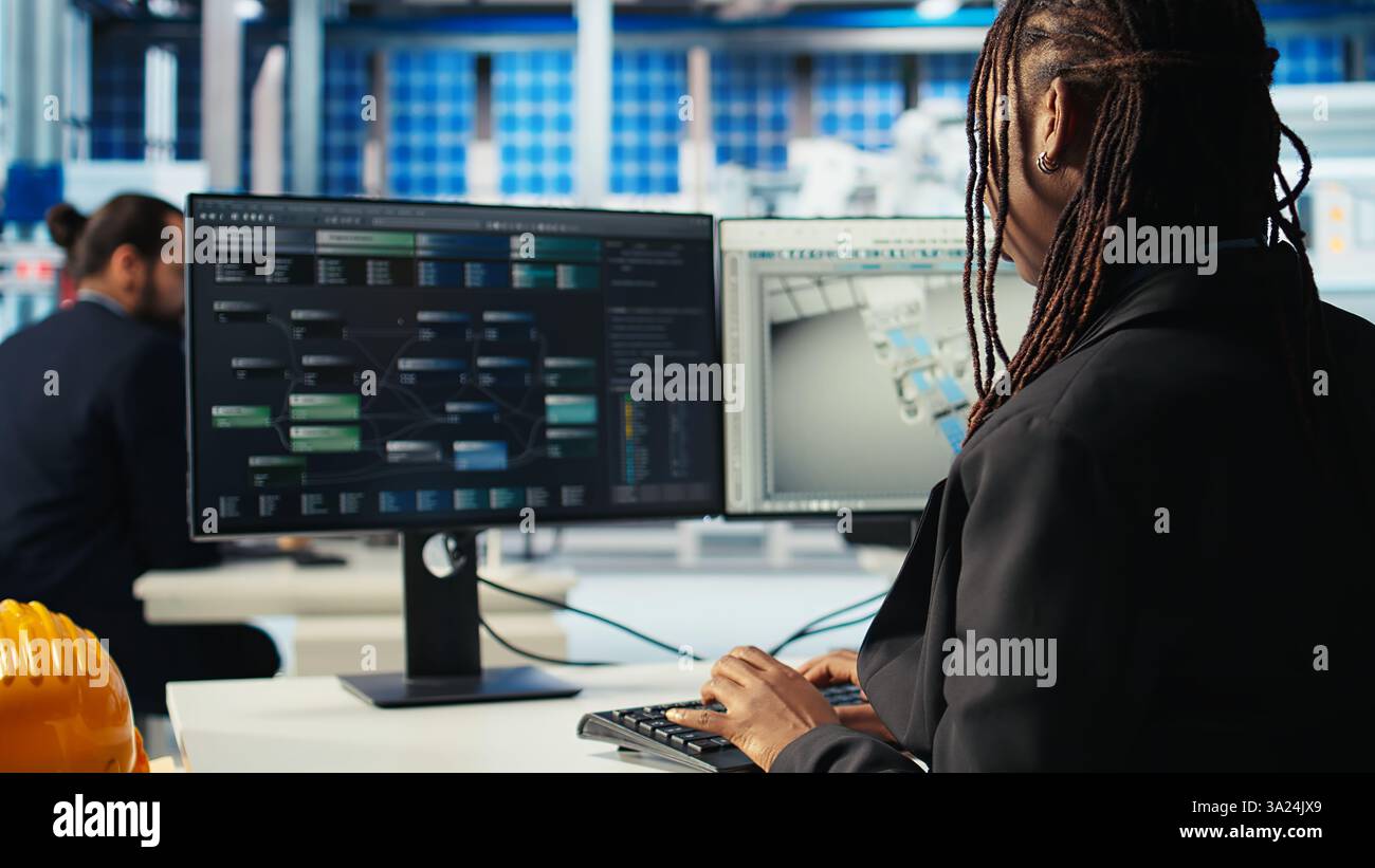 Photovoltaics factory programmer analyzing data with machine learning tech, reviewing system ...