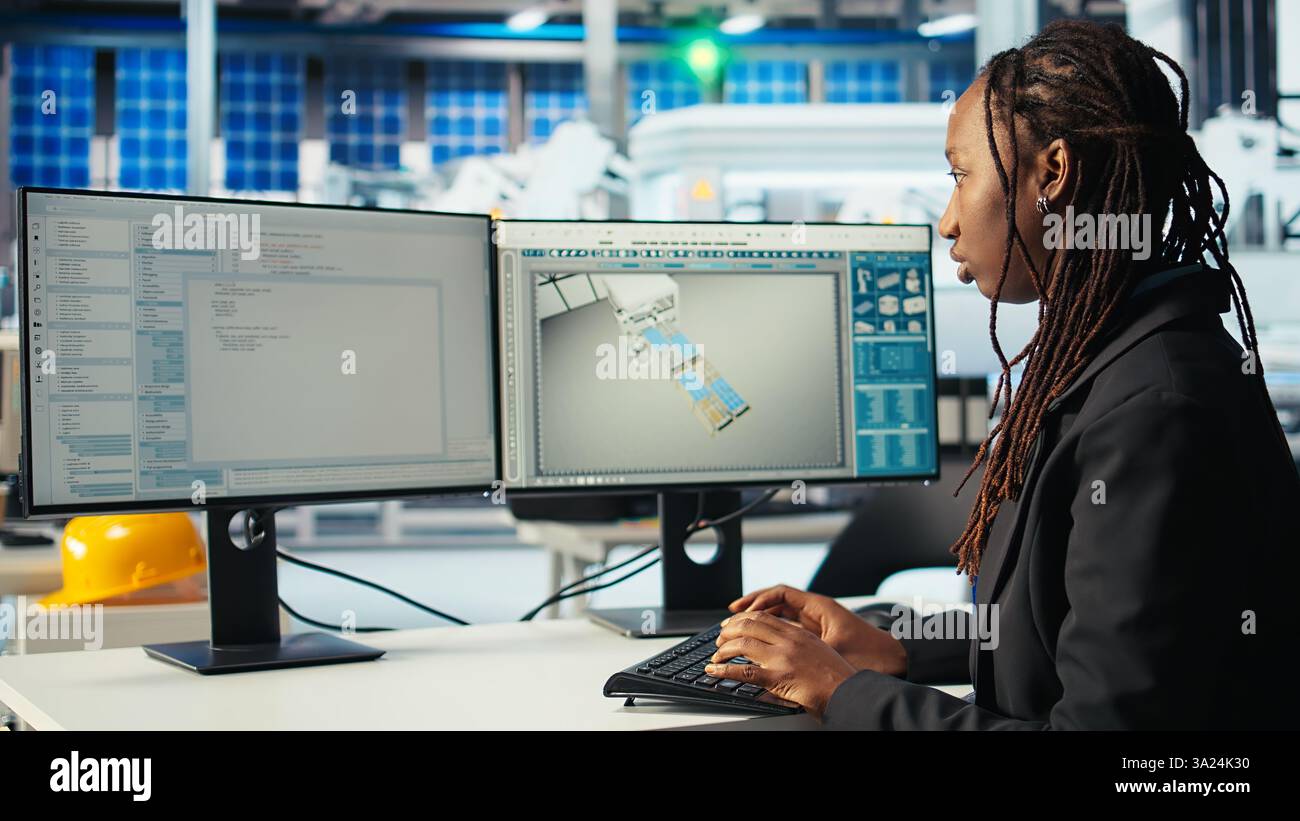 Programmer in photovoltaics factory using PC to update software of ...