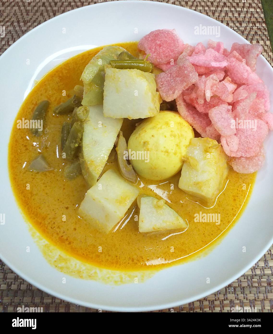 Lontong Sayur is a mild coconut based curry soup with cubes of lontong ...