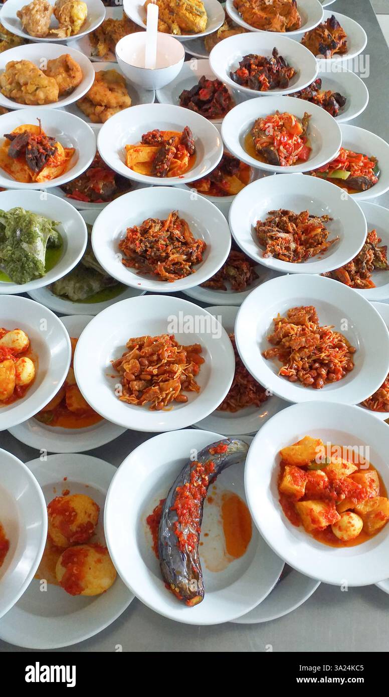 A selection of Nasi Padang dishes in a restaurant in Indonesia Stock ...