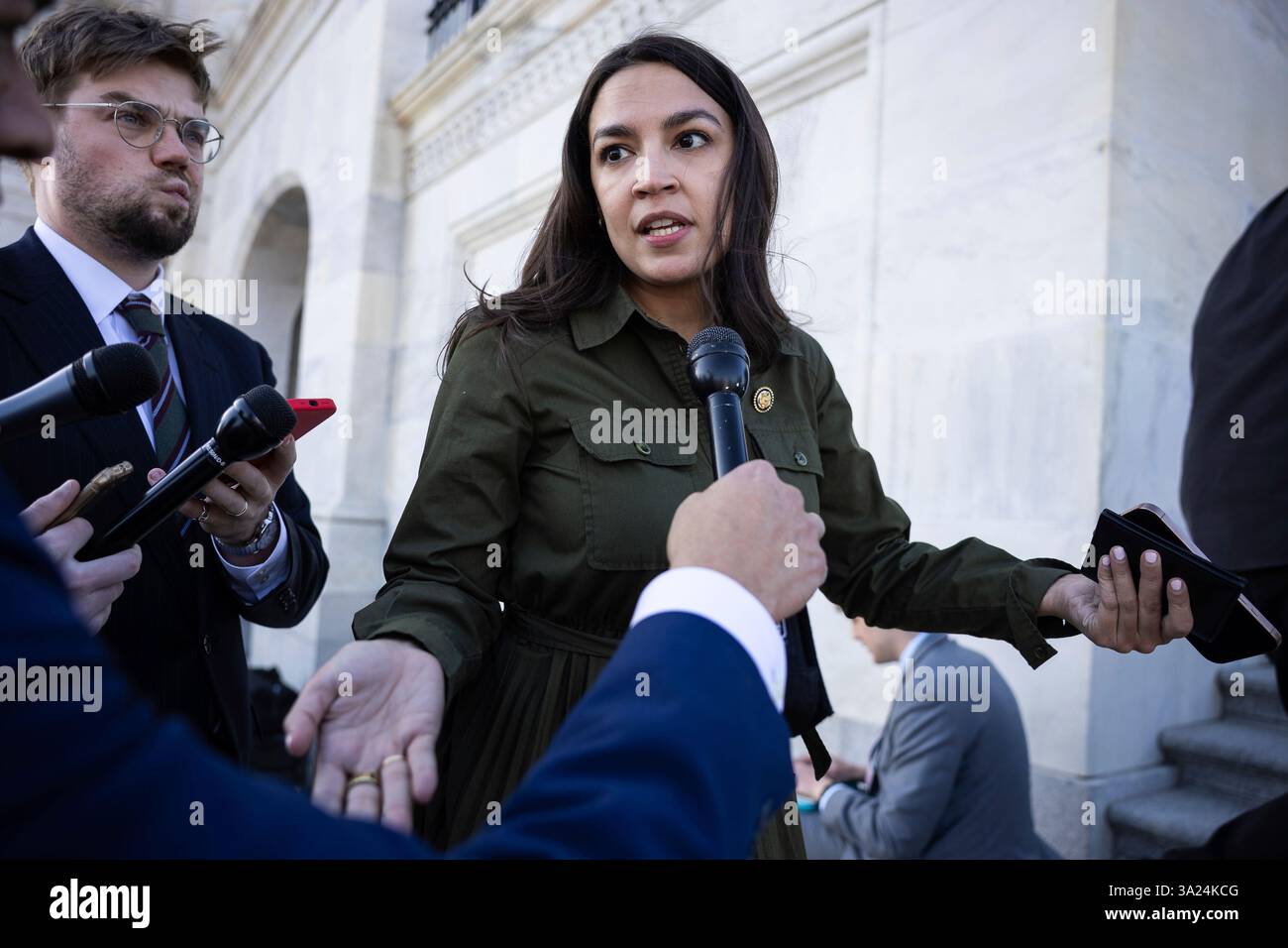 Rep. Alexandria Ocasio-Cortez (D-N.Y.) speaks with reporters as she ...