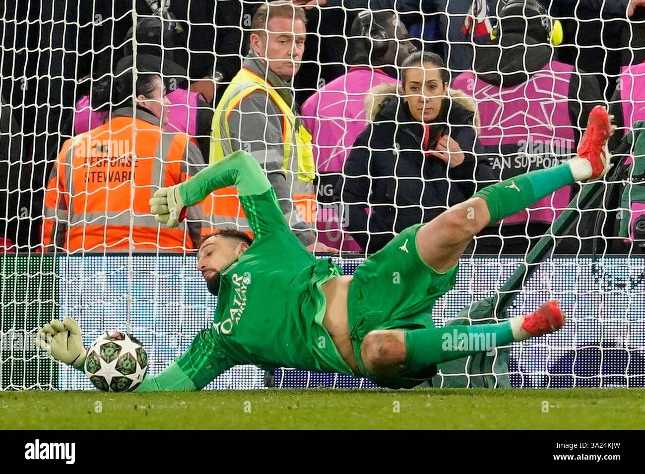 PSG's goalkeeper Gianluigi Donnarumma saves a penalty from Liverpool's ...