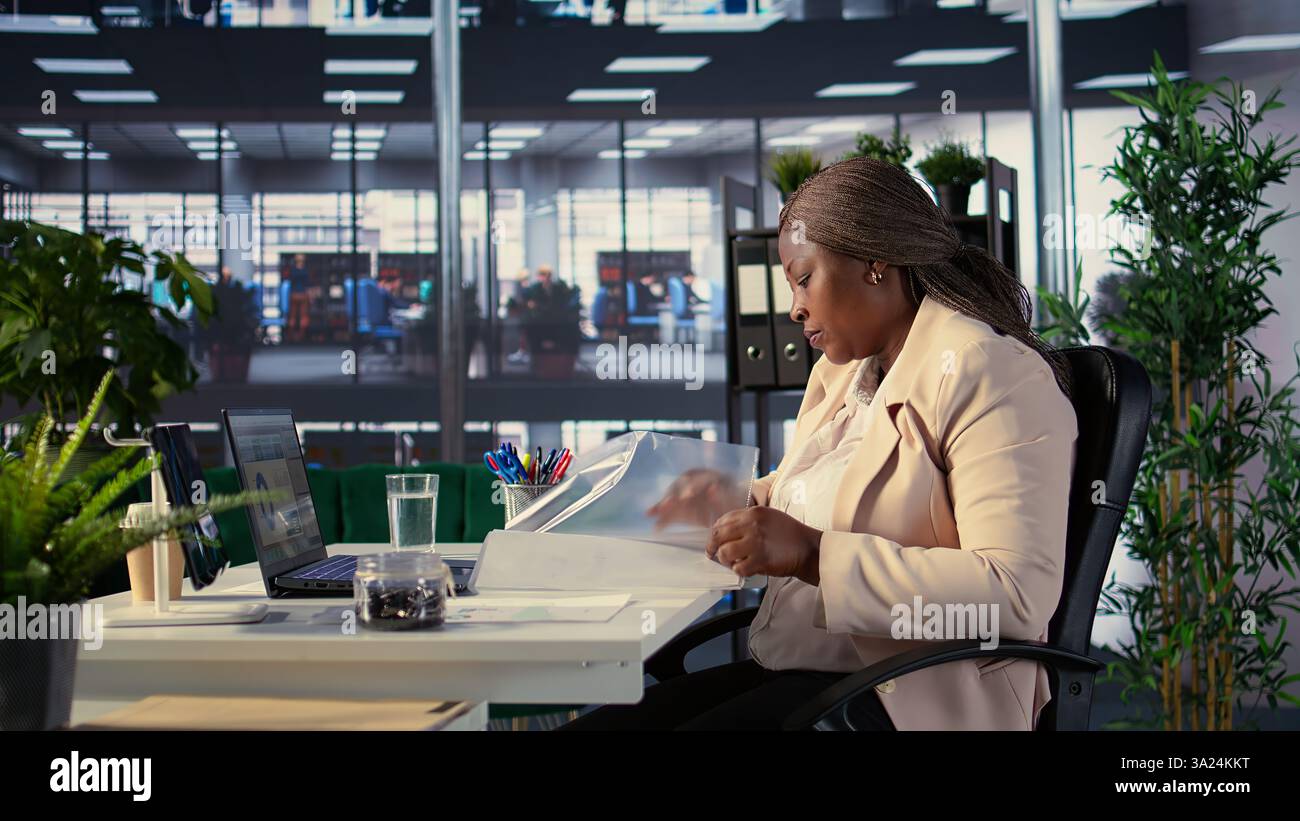 Empowered black CEO working in high end downtown corporate office ...