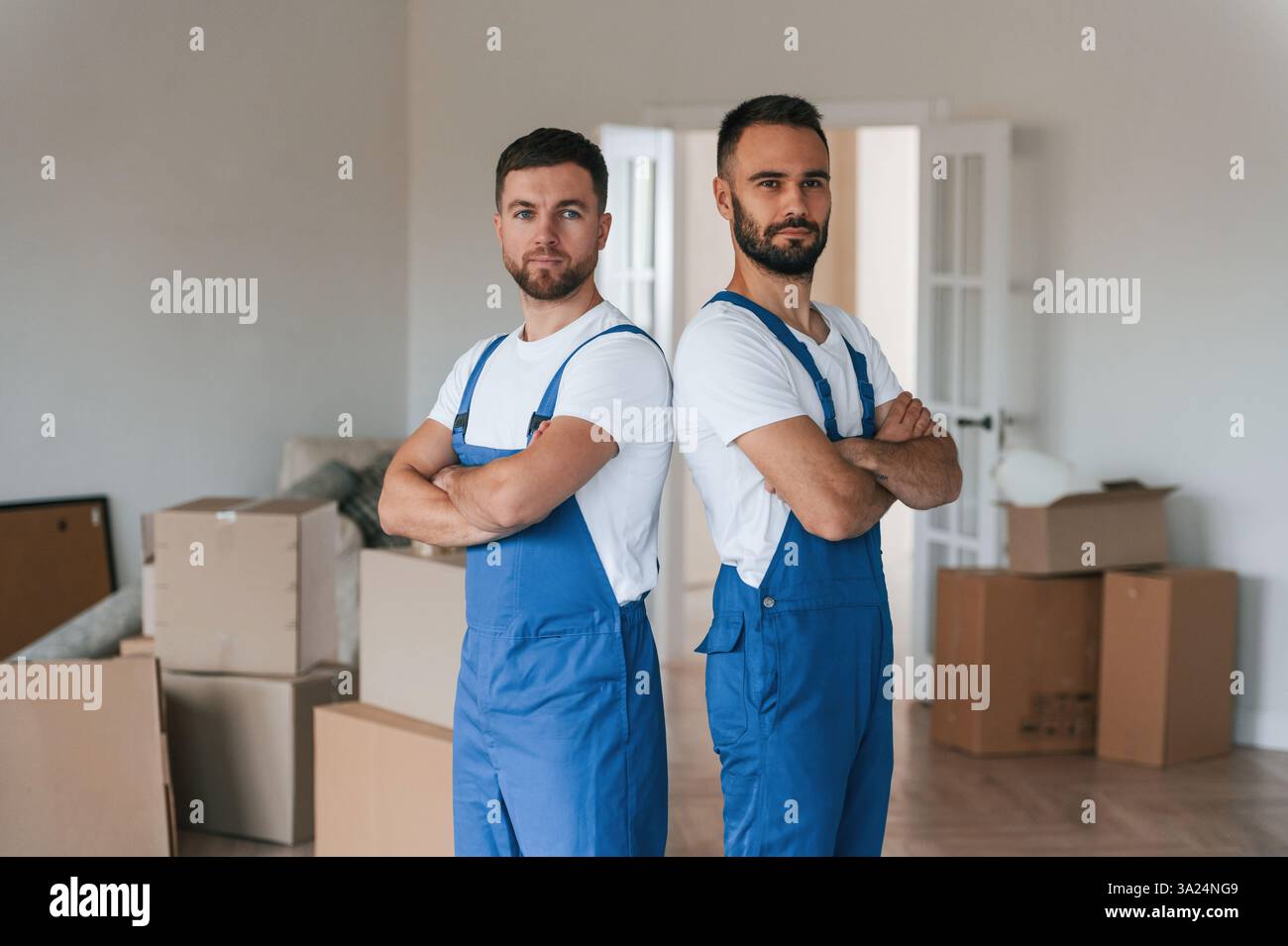 Blue uniform employees hi-res stock photography and images - Alamy